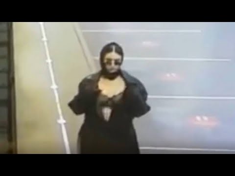 Mystery Woman Performs Mini Striptease For Tube Station CCTV Camera