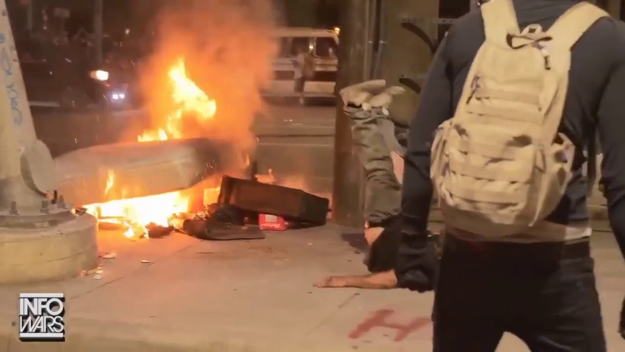 homeless man's belongings set on fire by protestors - YouTube