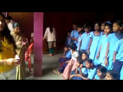 Divya K Murthy of KVK- NGO addressing government school students about dental care.