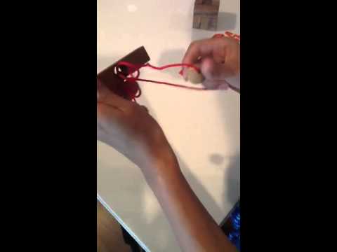 Ring and string puzzle solution, by Dilemma games - YouTube