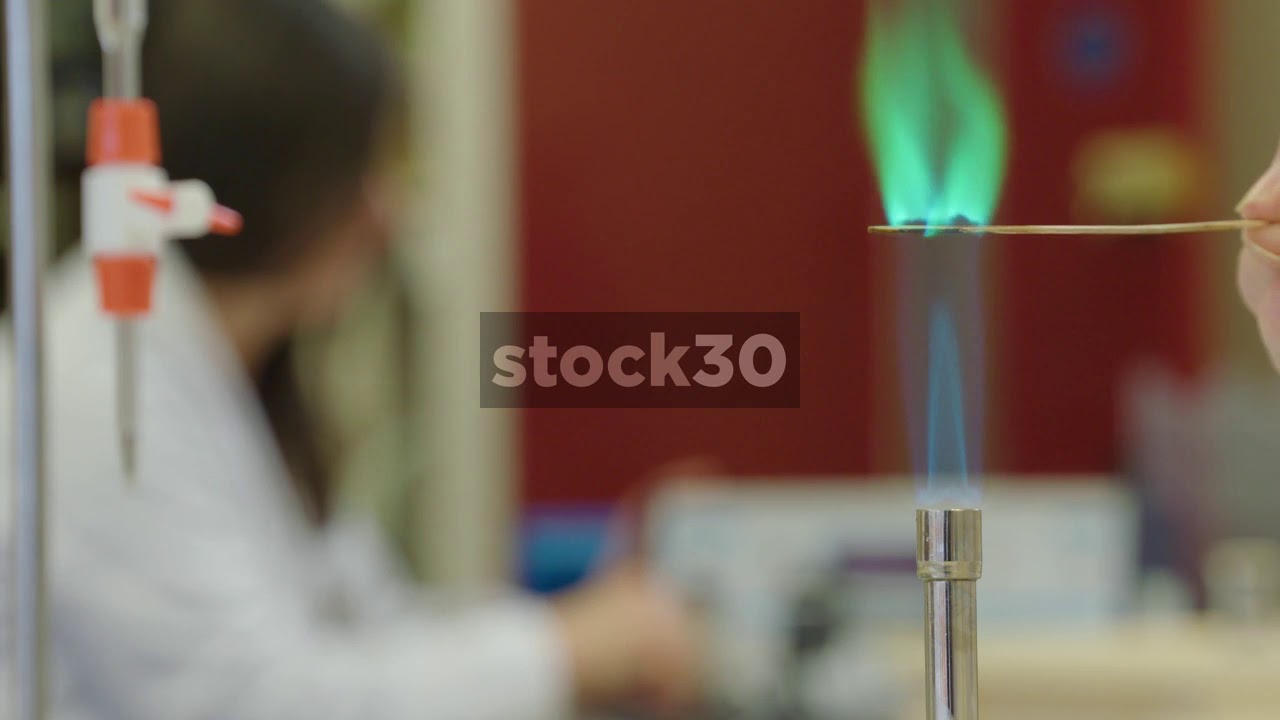 Scientist In Chemistry Lab Burning Chemical Off Spill With Bunsen ...