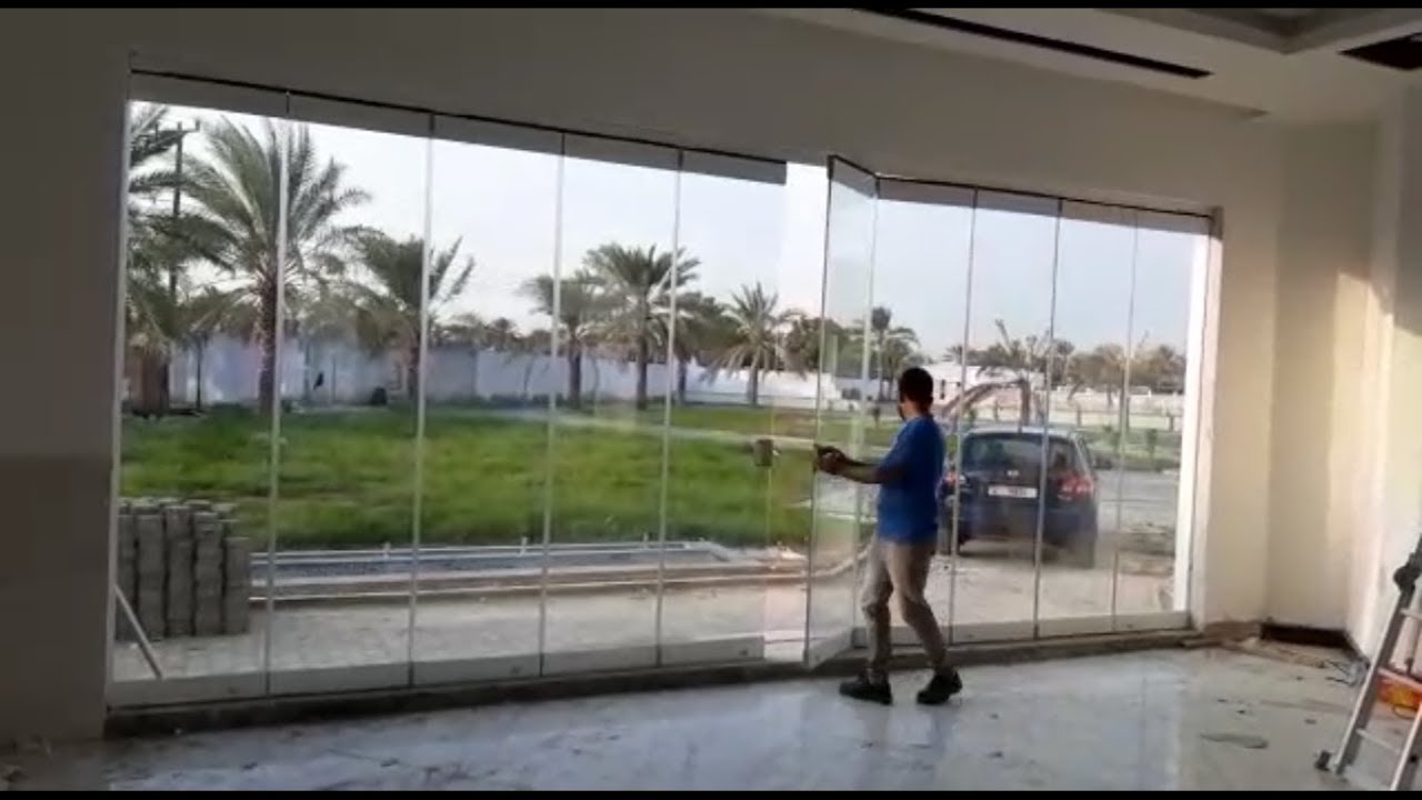 Aadco Frameless Glass Folding Door 10nos Panels (5+5 opening) At Halban ...