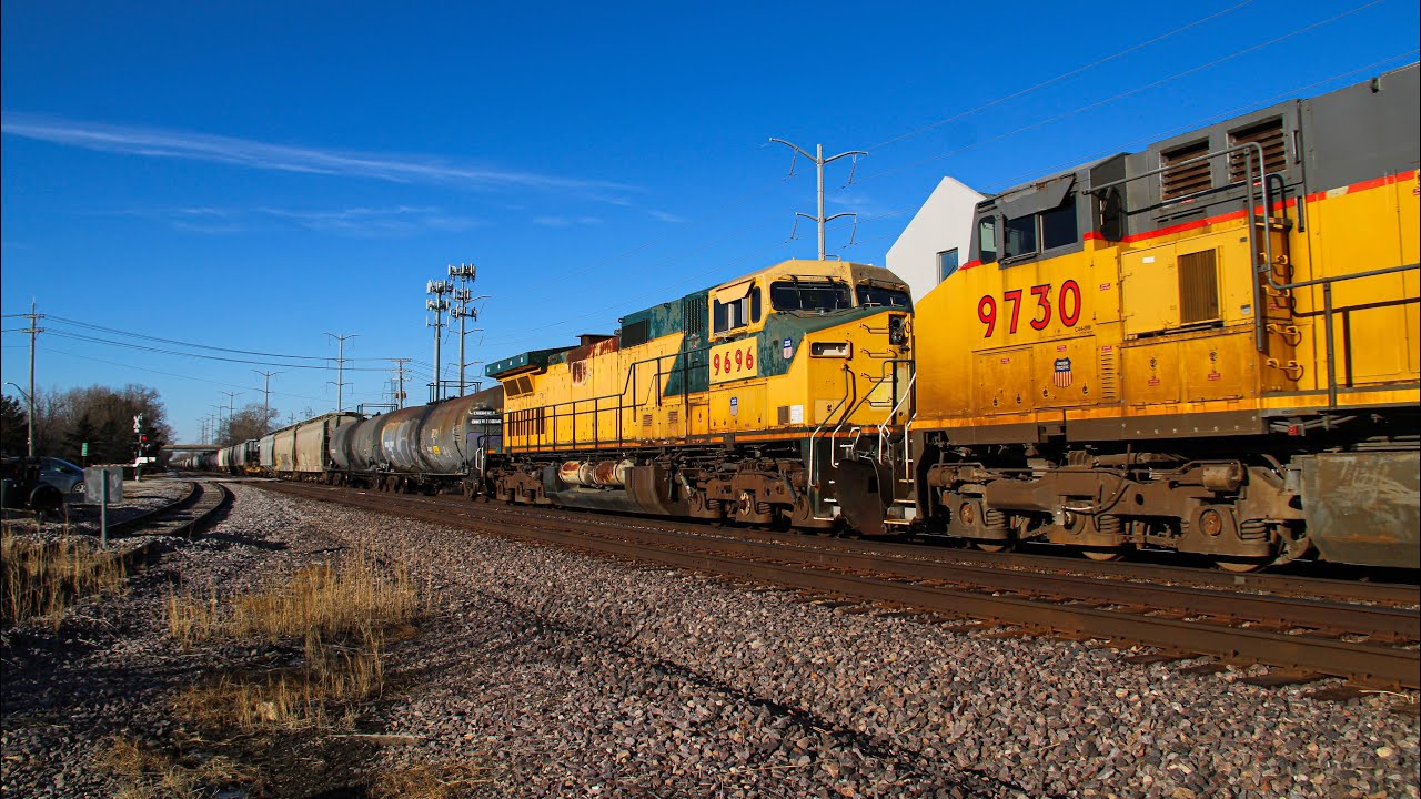 UP 9696 (CNW paint D9) and 3 more UP D9s trail on UP MALPR at Highland ...