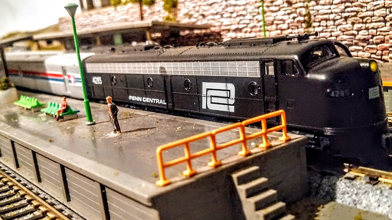 Early Amtrak train, PC E8A w long rainbow consist! w Conrail commuter ...