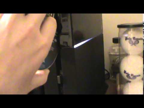 How to put a PS4 disk into the PS4 - YouTube