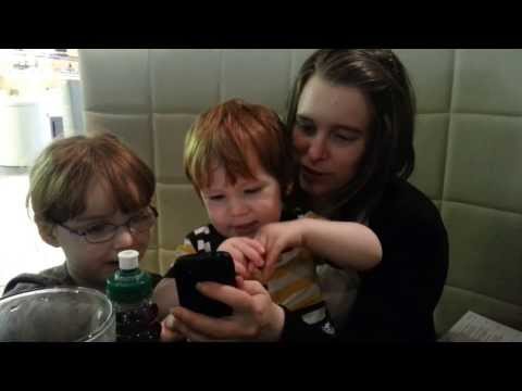 Katie and Adam Looking at Pictures on Aunty Michelle's Phone