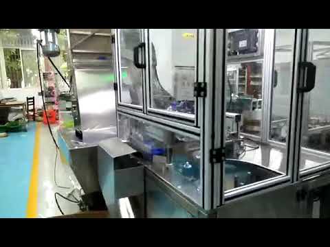 Large cap wadding lining inserting machine 2 - YouTube