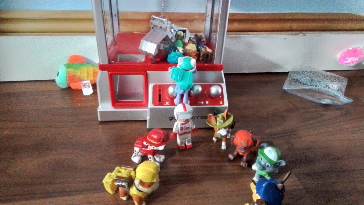 Big paw patrols try to get the small paw patrols out of a claw machine ...