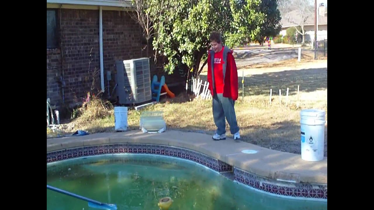 Breaking the ice in swimming pool, January 2010 - YouTube
