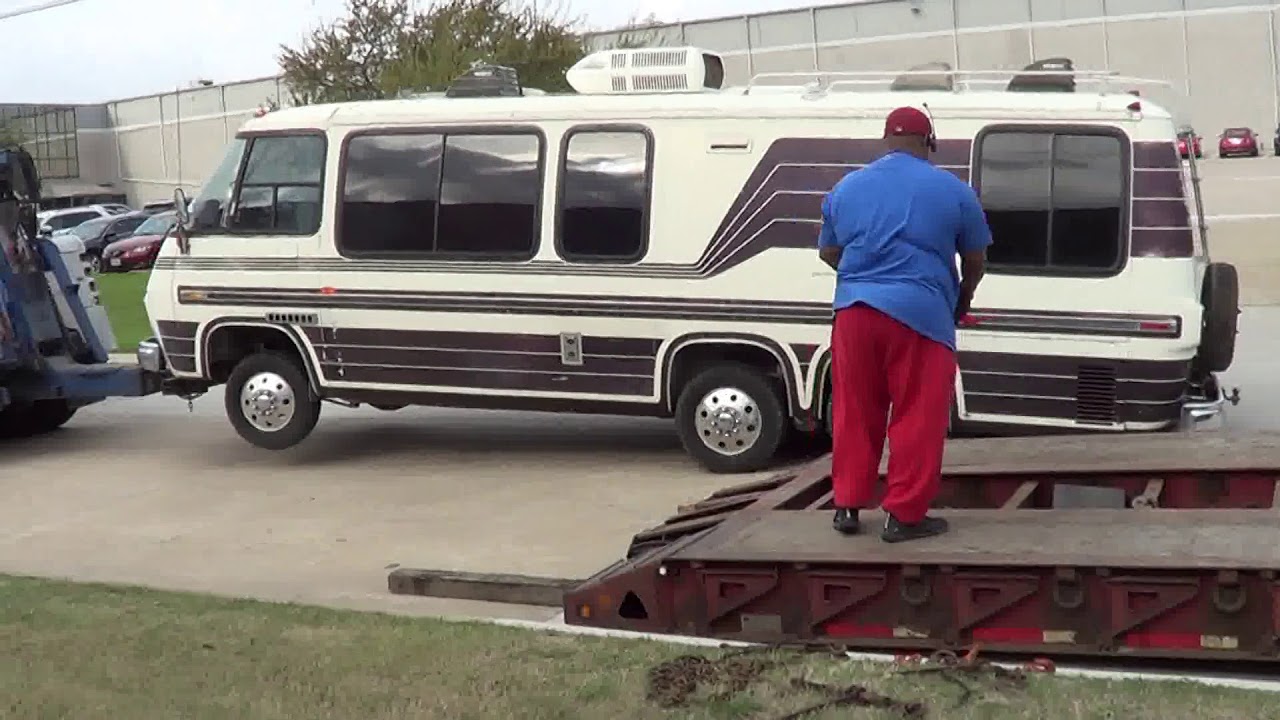 How to move a dead GMC motorhome onto a lowboy trailer - YouTube