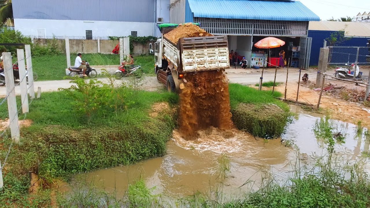 NEW Project Dump Truck Dumping soil to Flooded Bulldozer Pushing soil ...