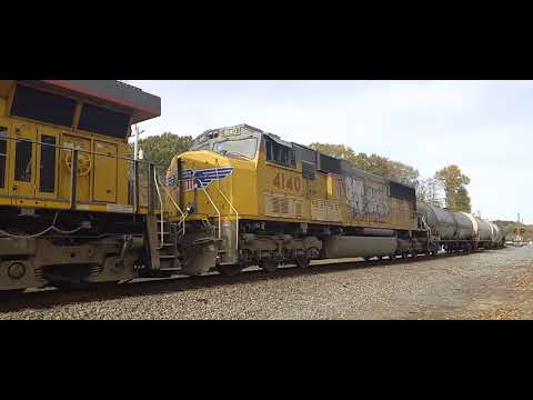 NS 153 with UP 2550 ES44AC-H UP 4140 SD70M mid train DPUs NS 9495 D9-40CW and KCS 5022 ET44AC ...