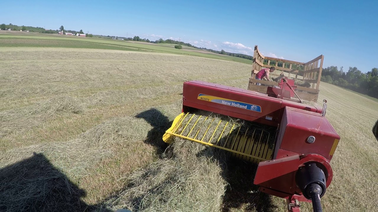 Baling heavy double windrow of hay 6/11/18 - YouTube