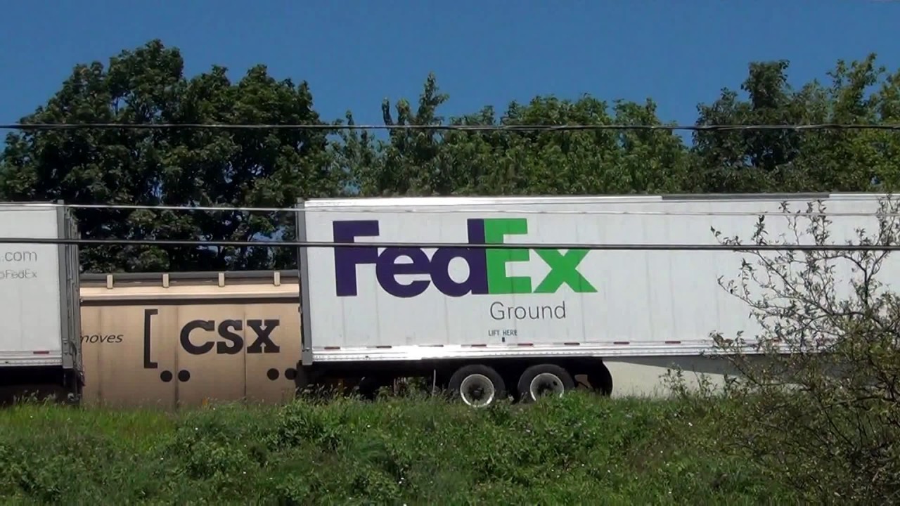 Big FedEx Van Train Heads East on Overhead Tracks - YouTube
