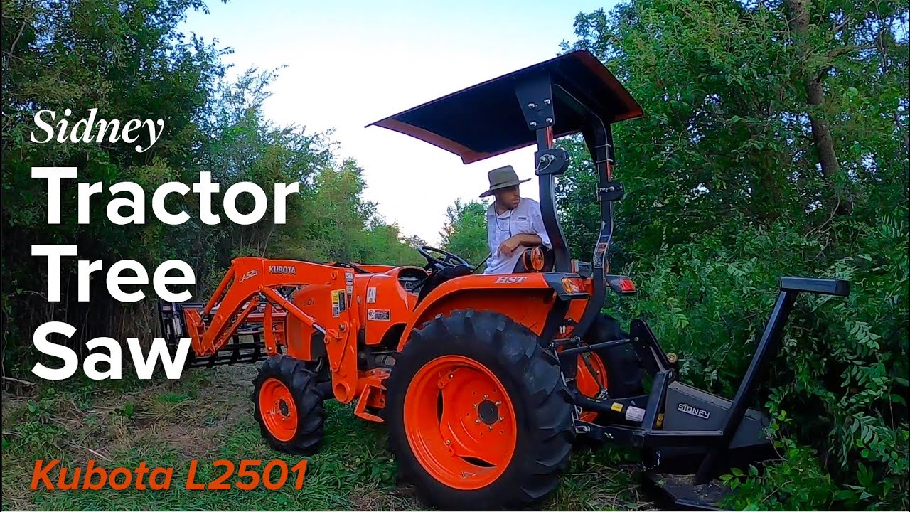 Kubota L2501 with Sidney Tractor Tree Saw widening path to the pond ...