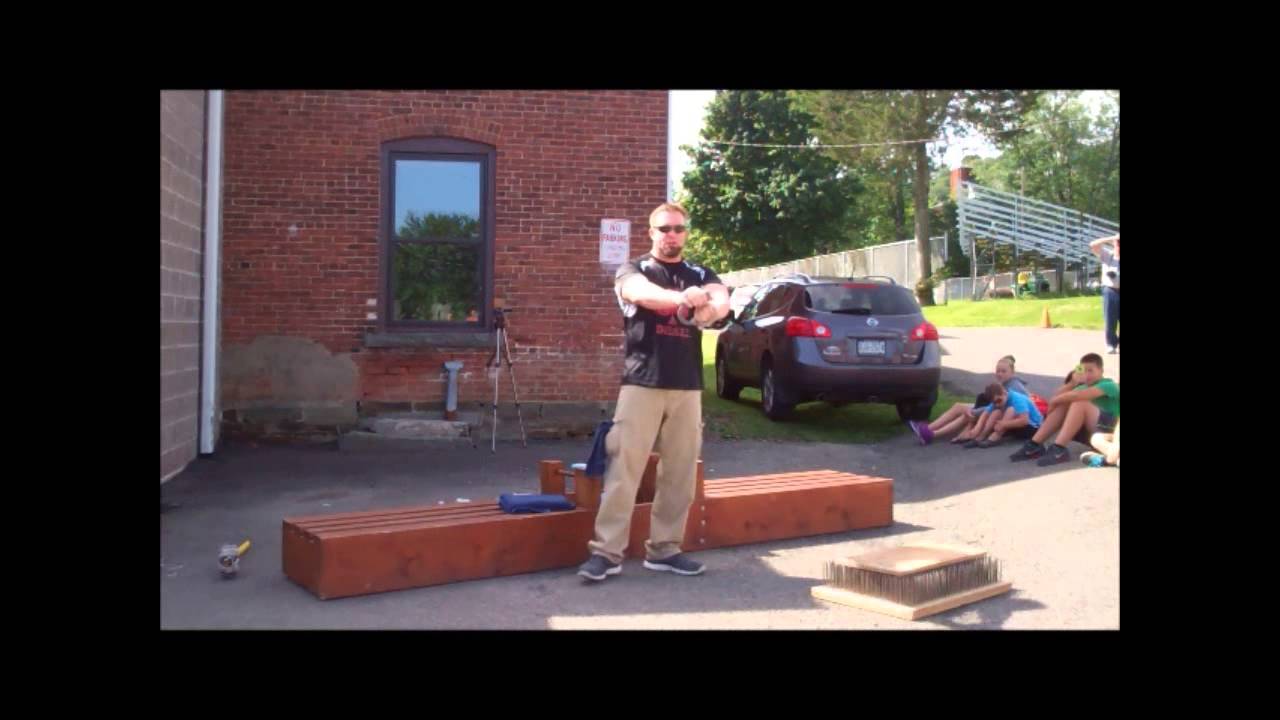 Strongman Feats: Jedd Johnson Bends a Horseshoe - YouTube