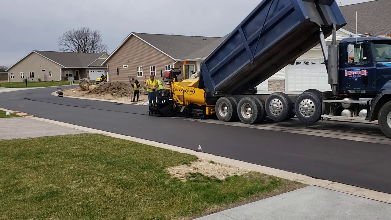 Paving subdivision road - YouTube