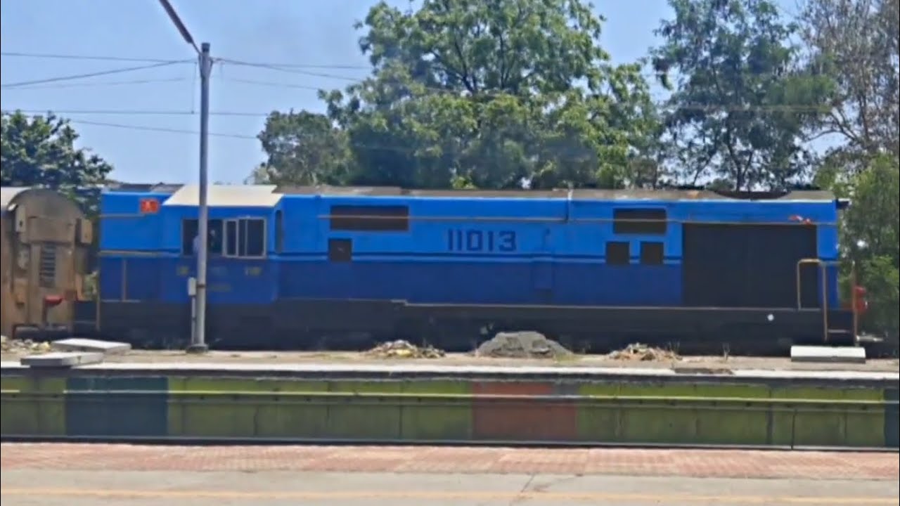 CORNFLOWER/DARK BLUE SHUNTER ENGINE SHUNTS EMPTY TRAIN AT TERMINUS YARD ...