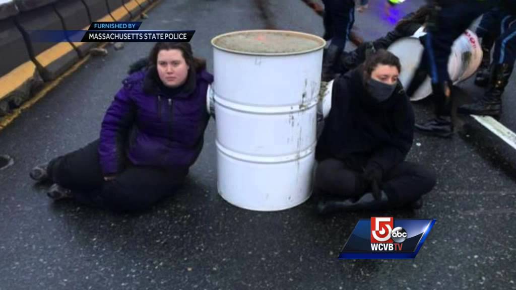 5 Investigates: Protesters handcuffed together through cement-filled ...