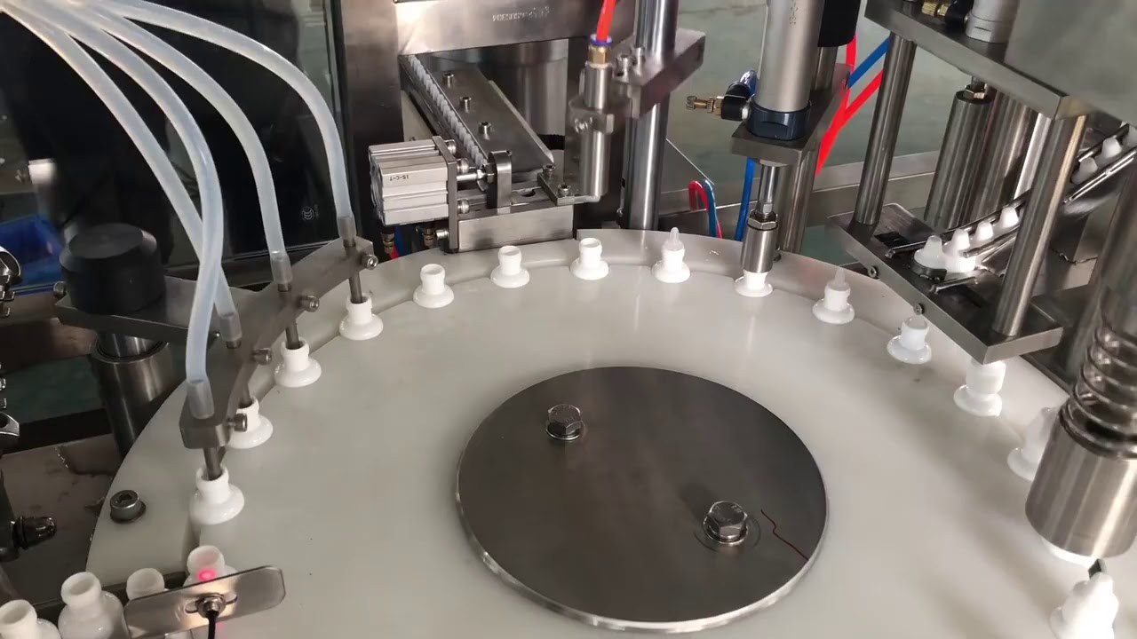 mini eye drop filling stoppering plugging and capping machine - YouTube