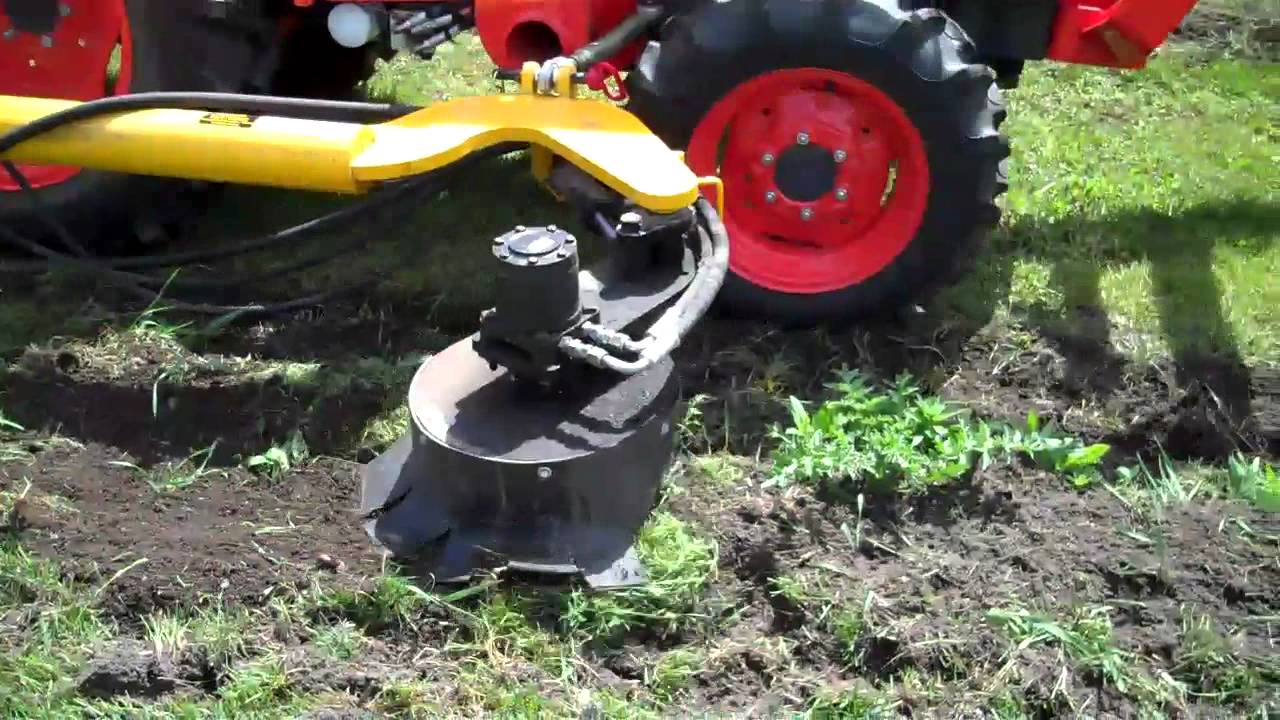 Weed badger with 38 hp Kubota weeding honeyberry plants - YouTube