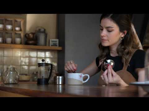 a woman in a coffee shop | After Effects