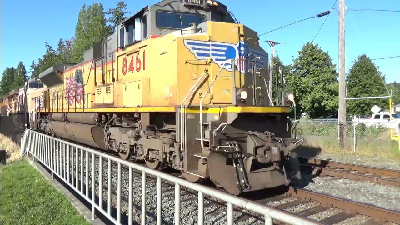 (Southbound) Union Pacific Mixed Freight Train passes through the Titlow Beach Railroad Crossing ...