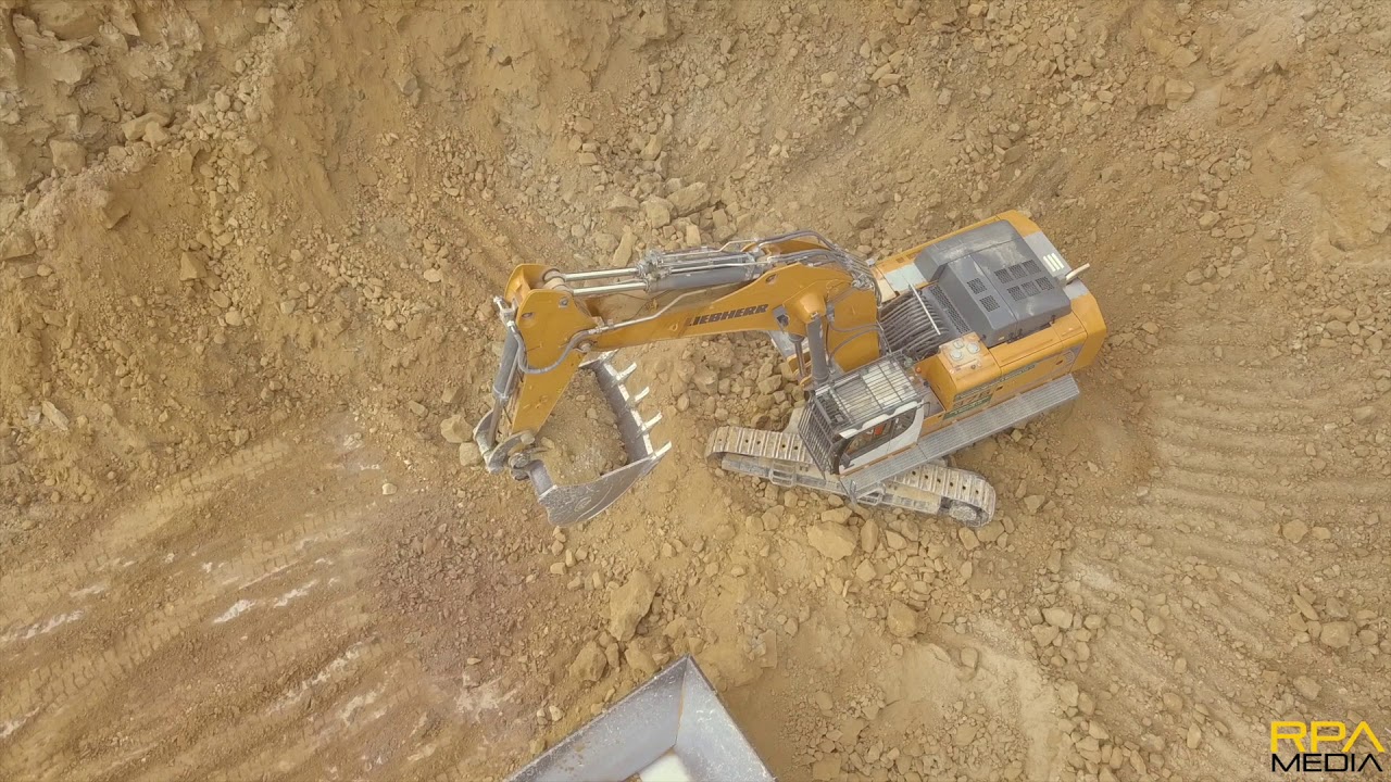 New Liebherr R976 loading a Gipo crusher - YouTube