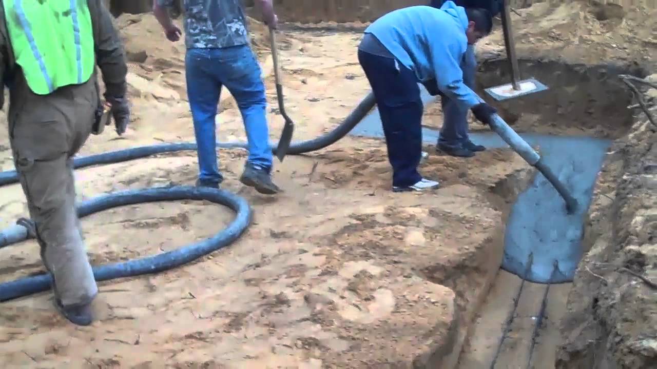 Pumping concrete for the footings - YouTube