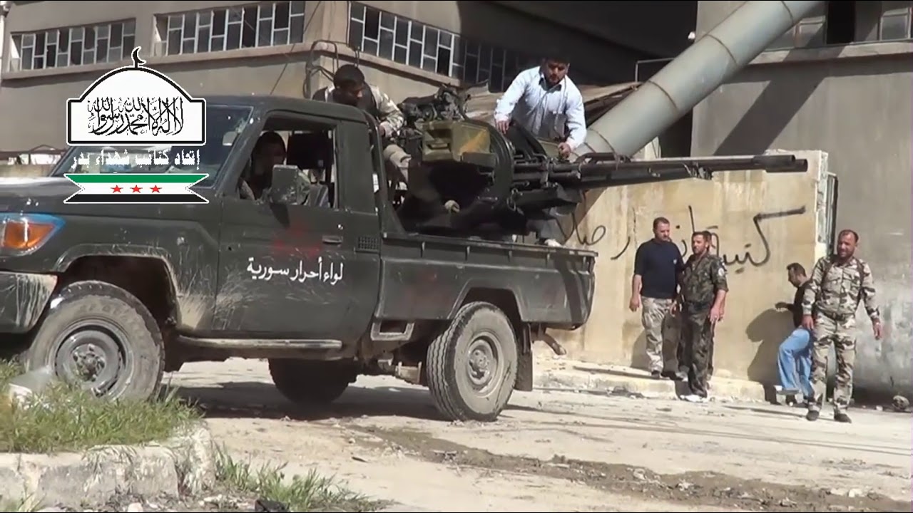 Anti-aircraft gun ZU 23-2 on the basis of a pickup truck is firing ...