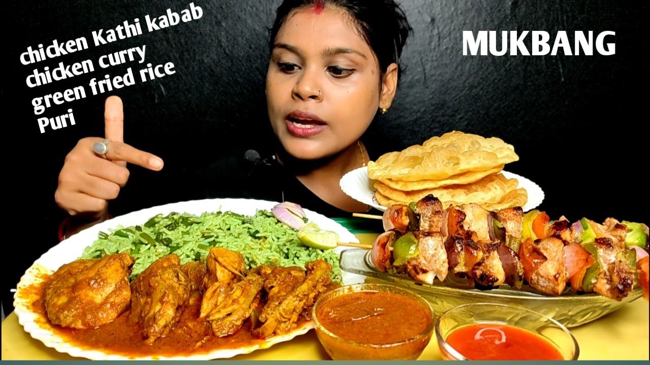 chicken Kathi kabab, chicken curry, green fried rice and puri eating. # ...