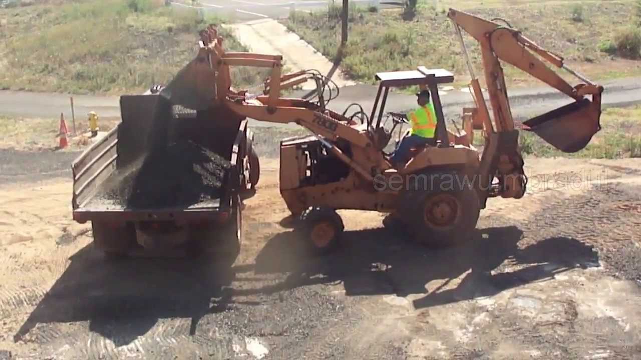 Backhoe 780B Loading sand to Dump Truck - YouTube