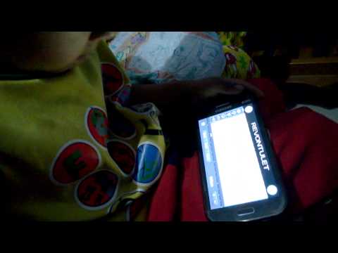 Son is playing music composer app in mobile.