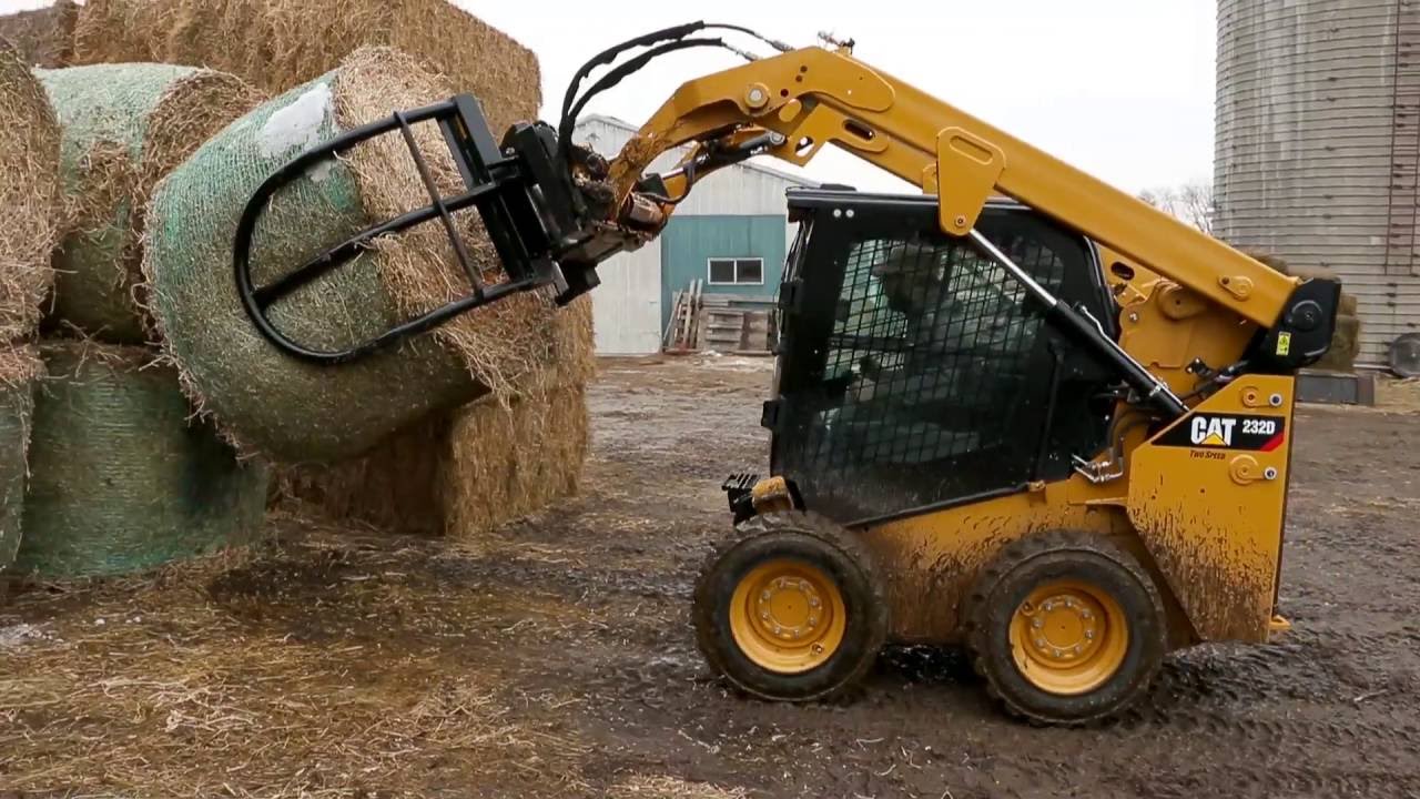 Cat® Bale Grab Attachment at Work - YouTube
