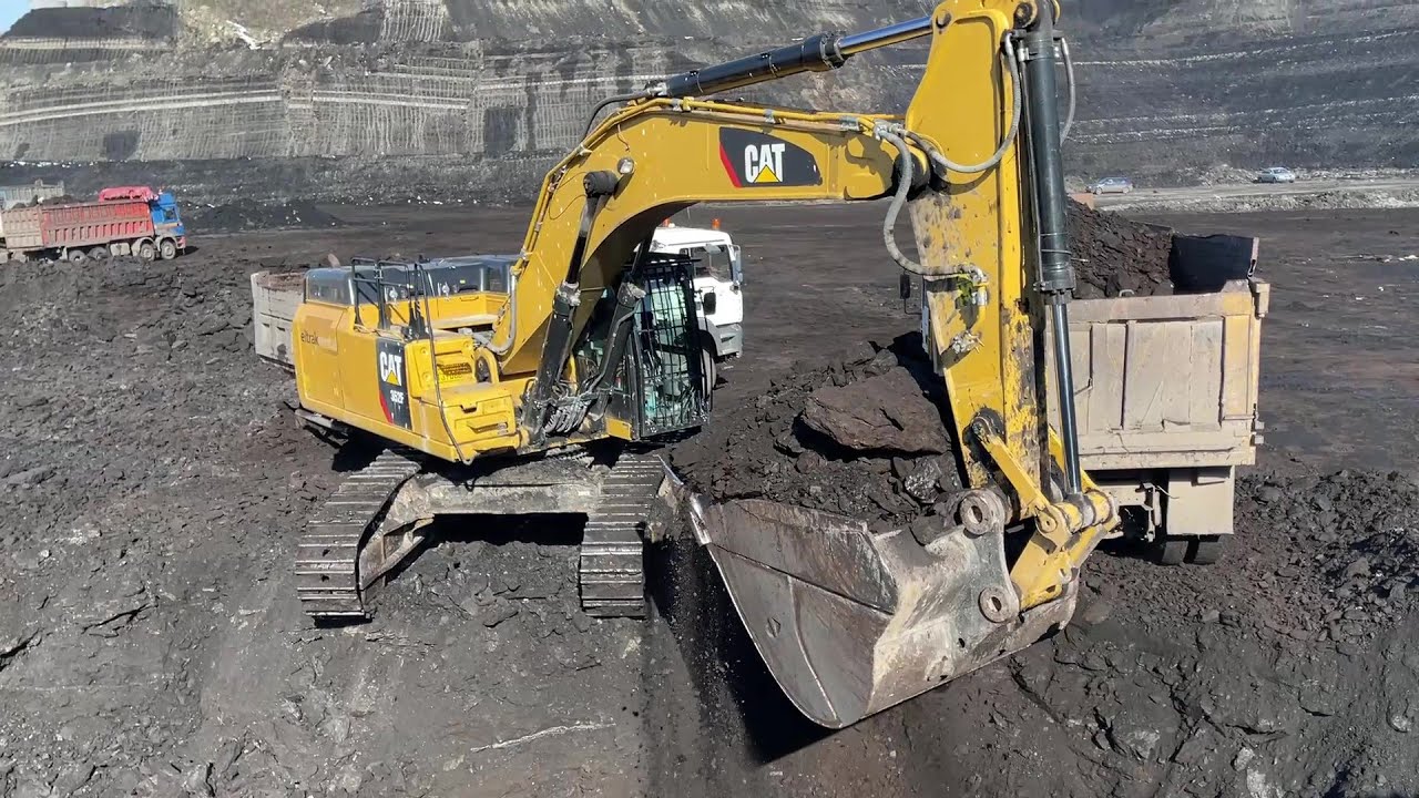 Caterpillar 352F Excavator Loading Mercedes & Man Trucks With Coal ...