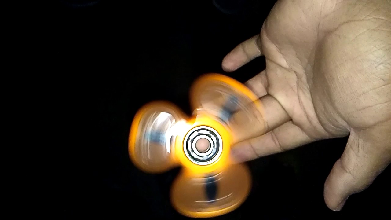 How a fidget spinner works in slow motion - YouTube
