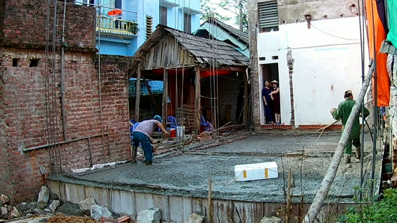 Classic technology to shovel concrete into ice foundation beams - YouTube