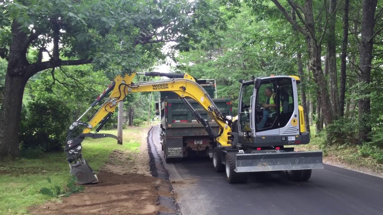 Wacker Neuson EW65 compact wheeled excavator. - YouTube