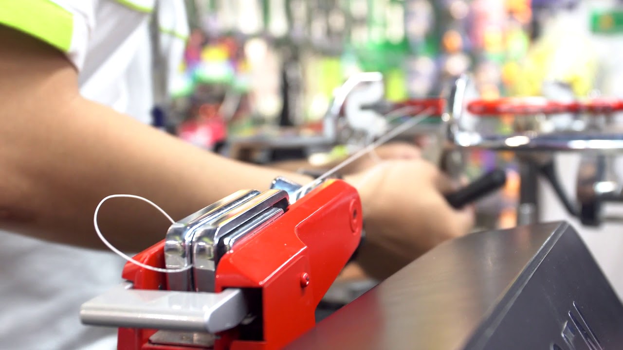 4k stock footage of man made weaving badminton racket by auto - YouTube