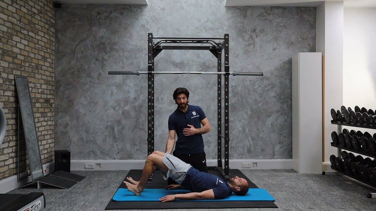 Heel Hip Bridge focused on the hamstrings pushing on heels - YouTube