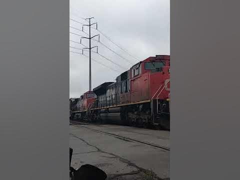 CN M383 with a dash 9 trailing in Delray - YouTube