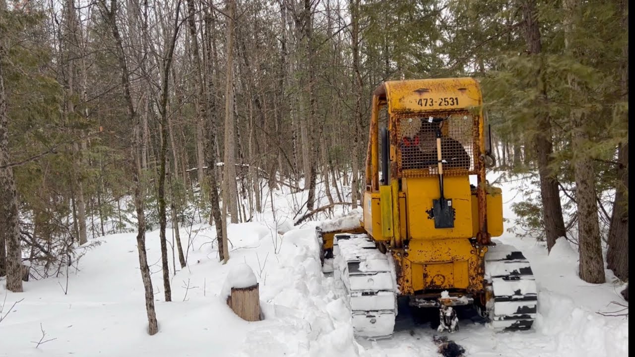 Plowing trails with the John Deere 450B bulldozer - YouTube