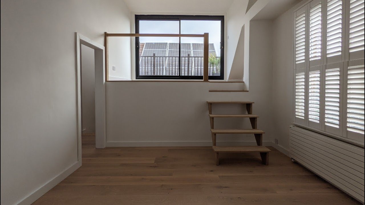 A split level top floor flat transformed by wide engineered oak boards ...