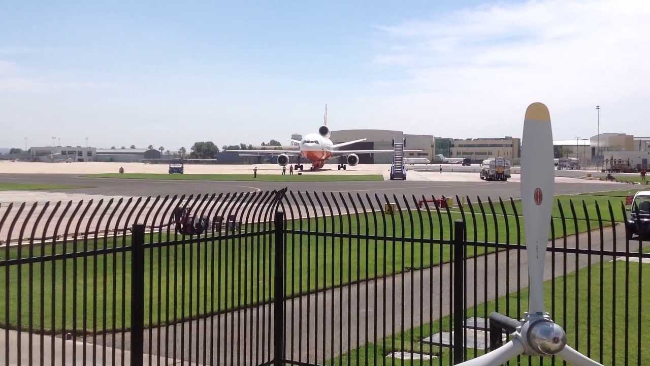 DC-10 Fire Tanker starting all three engines and taxiing to runway ...