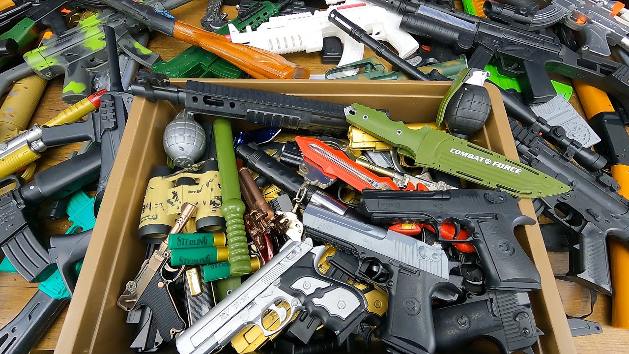 Arsenal Of Toy Guns And Rifles, Plastic Box Full Of Pistols And Guns ...