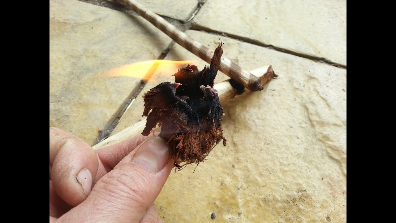 Fire lighting the old way - the hand drill method of rubbing sticks ...