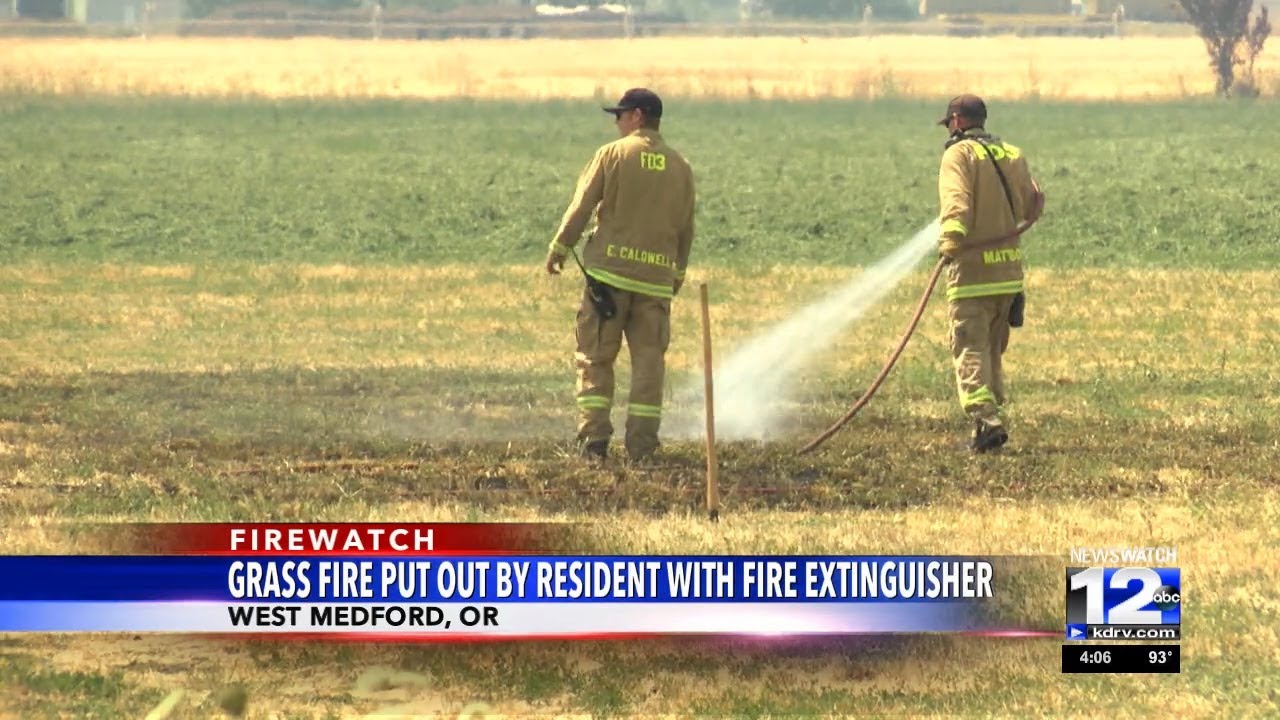 Grass fire put out by resident with fire extinguisher - YouTube