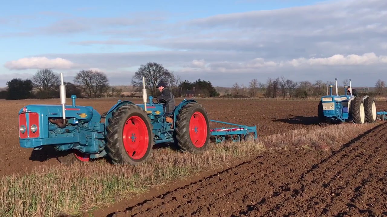 Two Doe Triple D tractors ploughing - YouTube