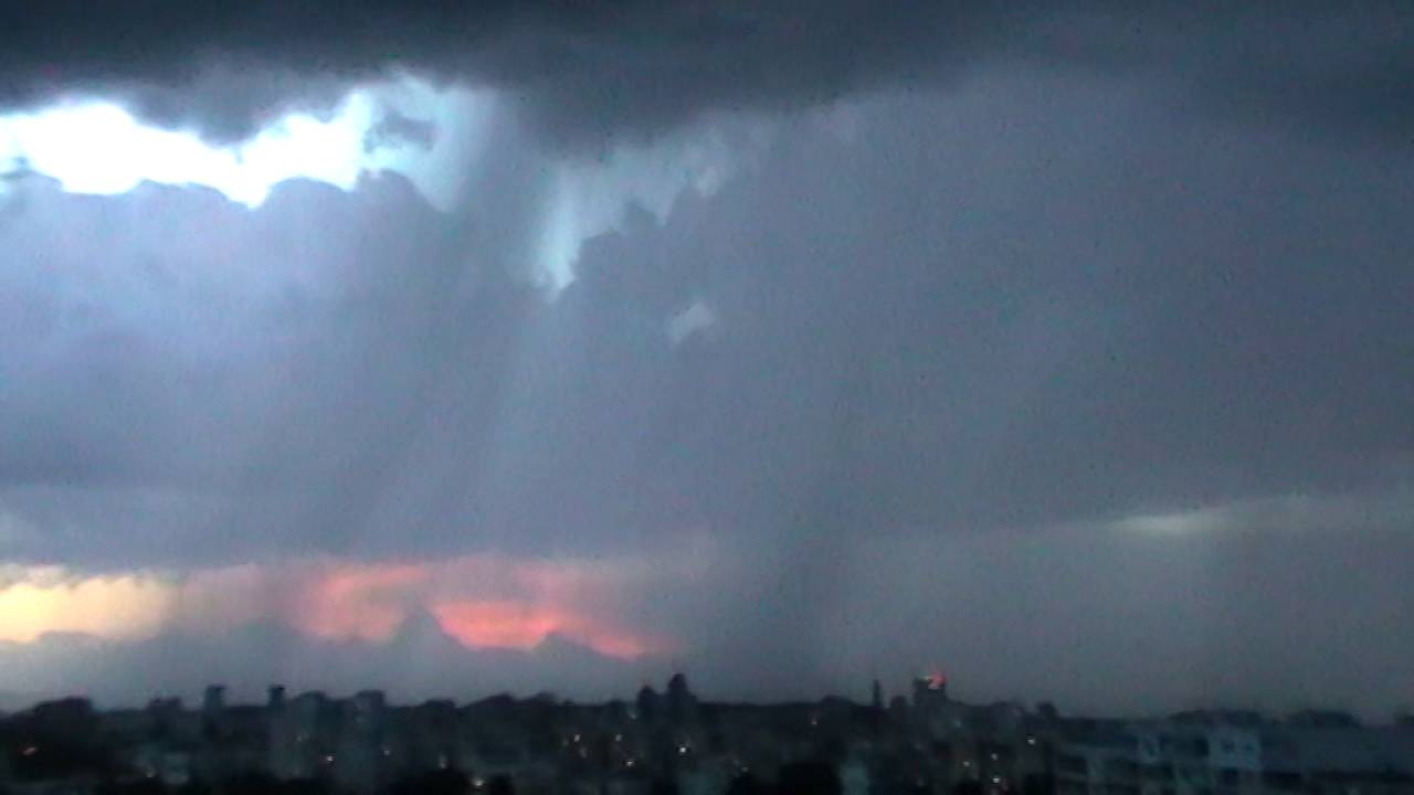 Beautiful storm with lightnings and visible rain in the distance - YouTube