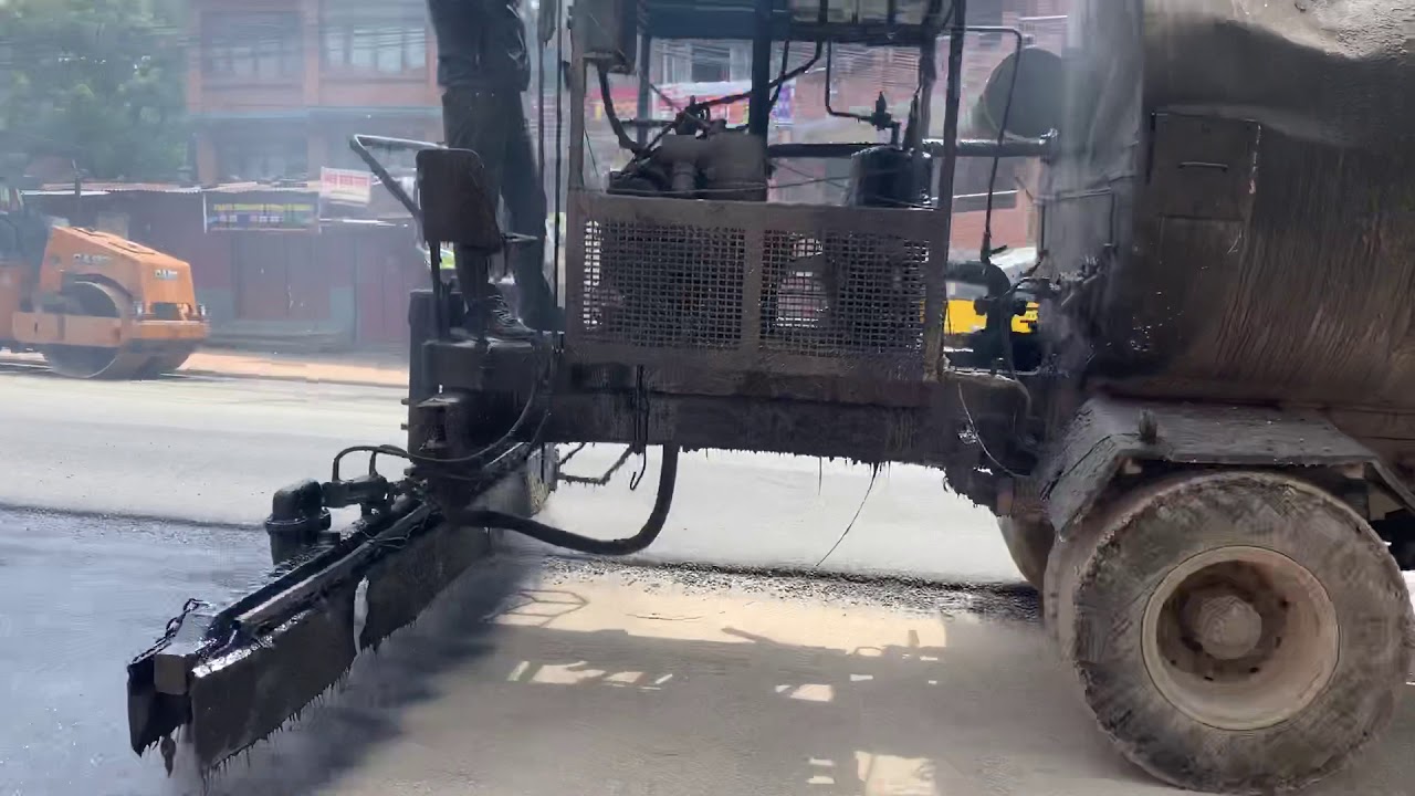 Tack coat during asphalt overlay - YouTube